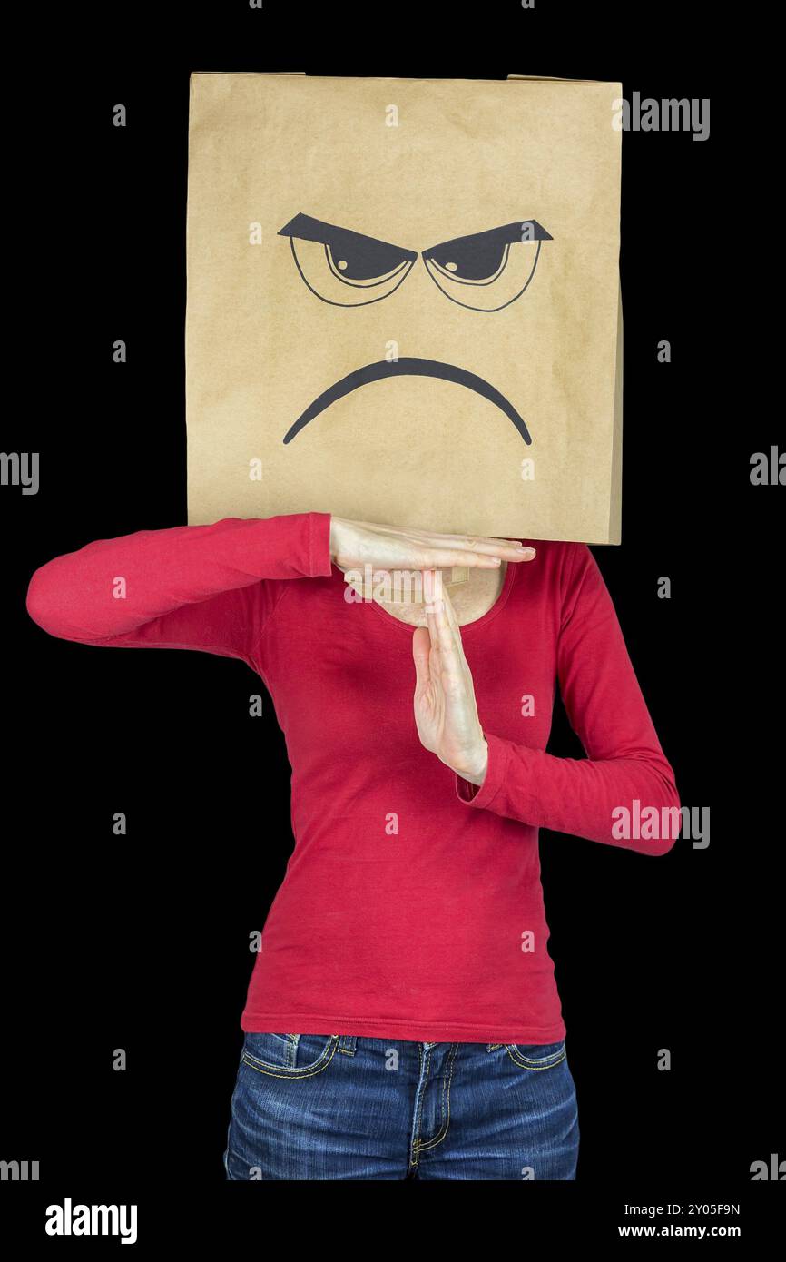 Woman expressing anger making gesture of time out isolated on black ...