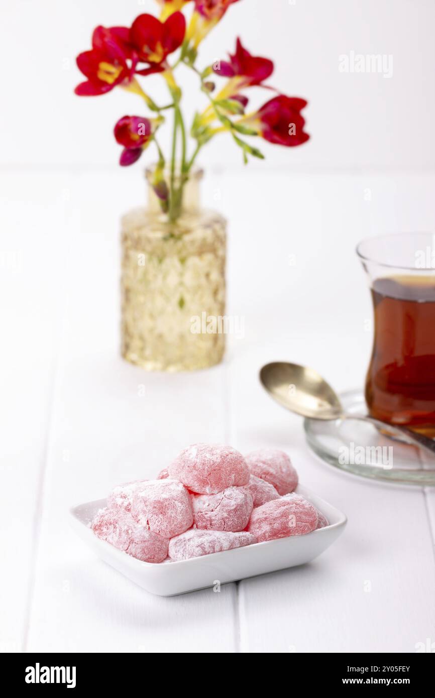 Traditional Turkish delights with oriental tea on white background ...