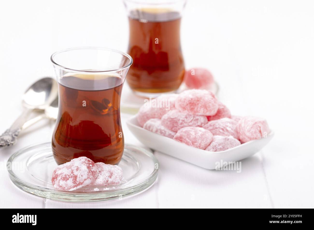 Traditional Turkish delights with oriental tea on white background ...