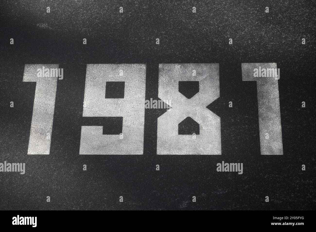 A black granite slab with white numbers 1981 on it Stock Photo - Alamy