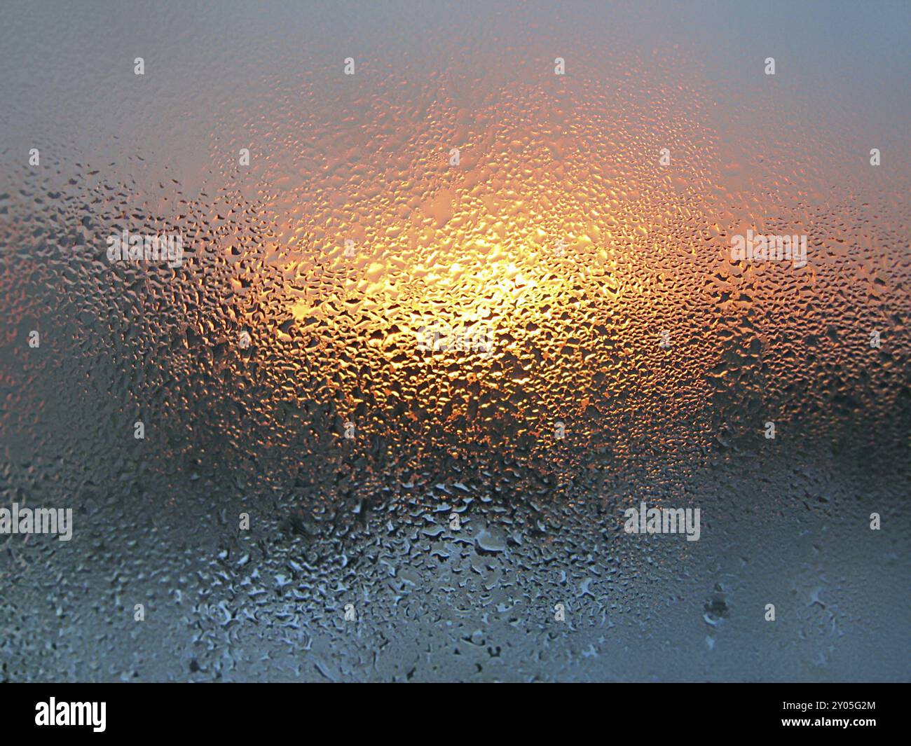 Water drops and sunlight on window glass Stock Photo - Alamy
