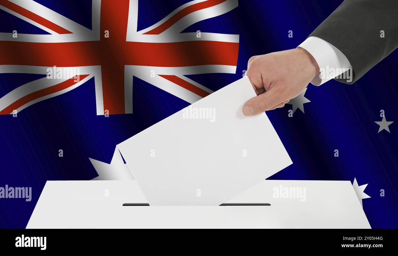 The Australian flag and the hand with the bulletin about the ballot box ...