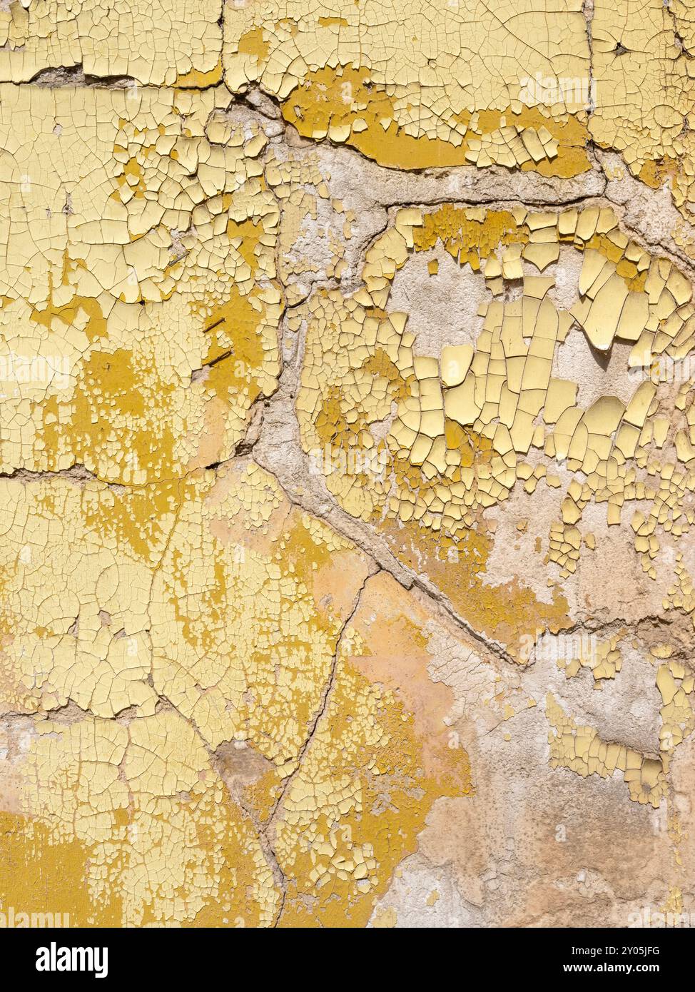 cracked yellow paint on stucco of old wall somewhere in france Stock ...