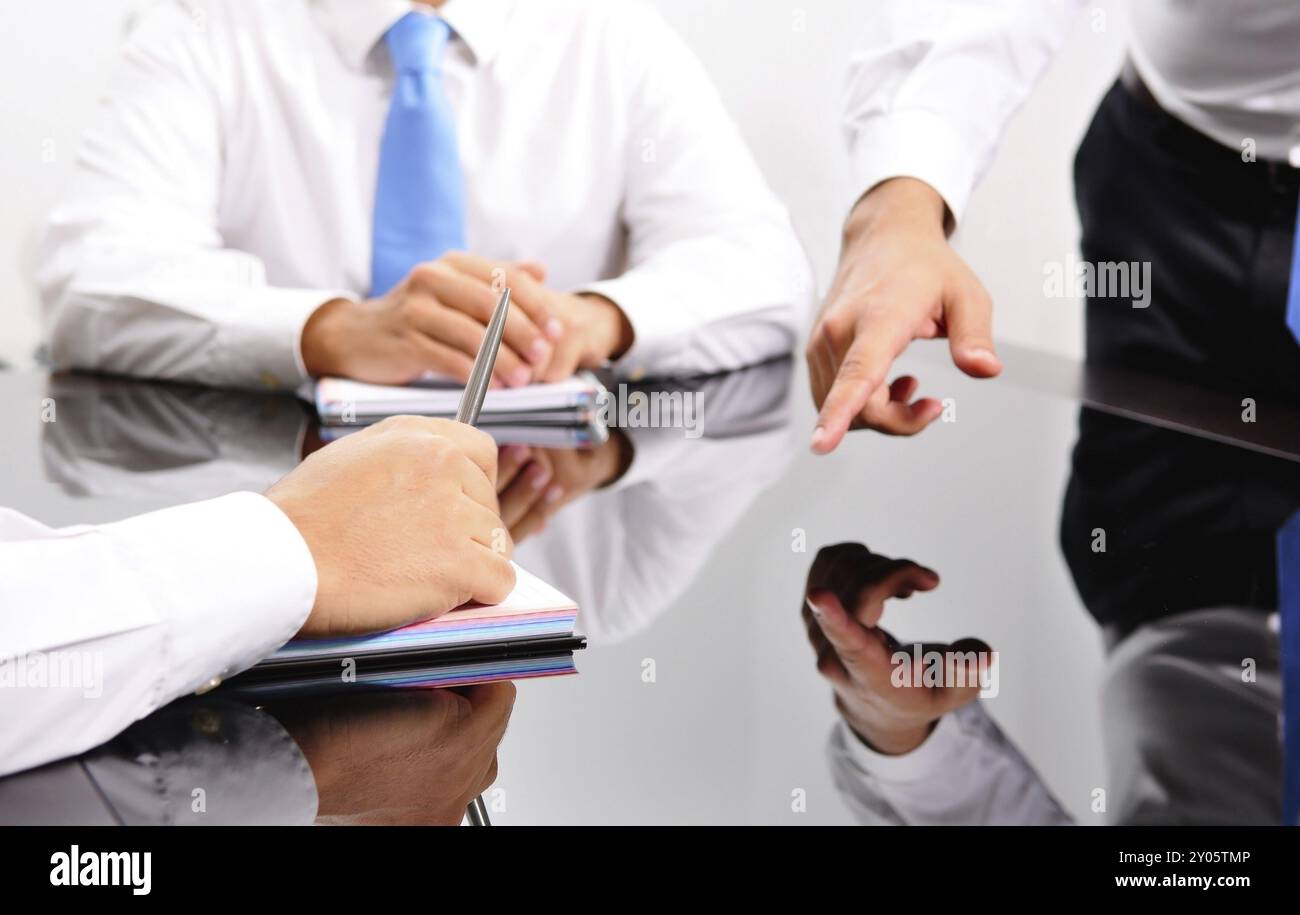 Business meeting between three businessmen Stock Photo - Alamy