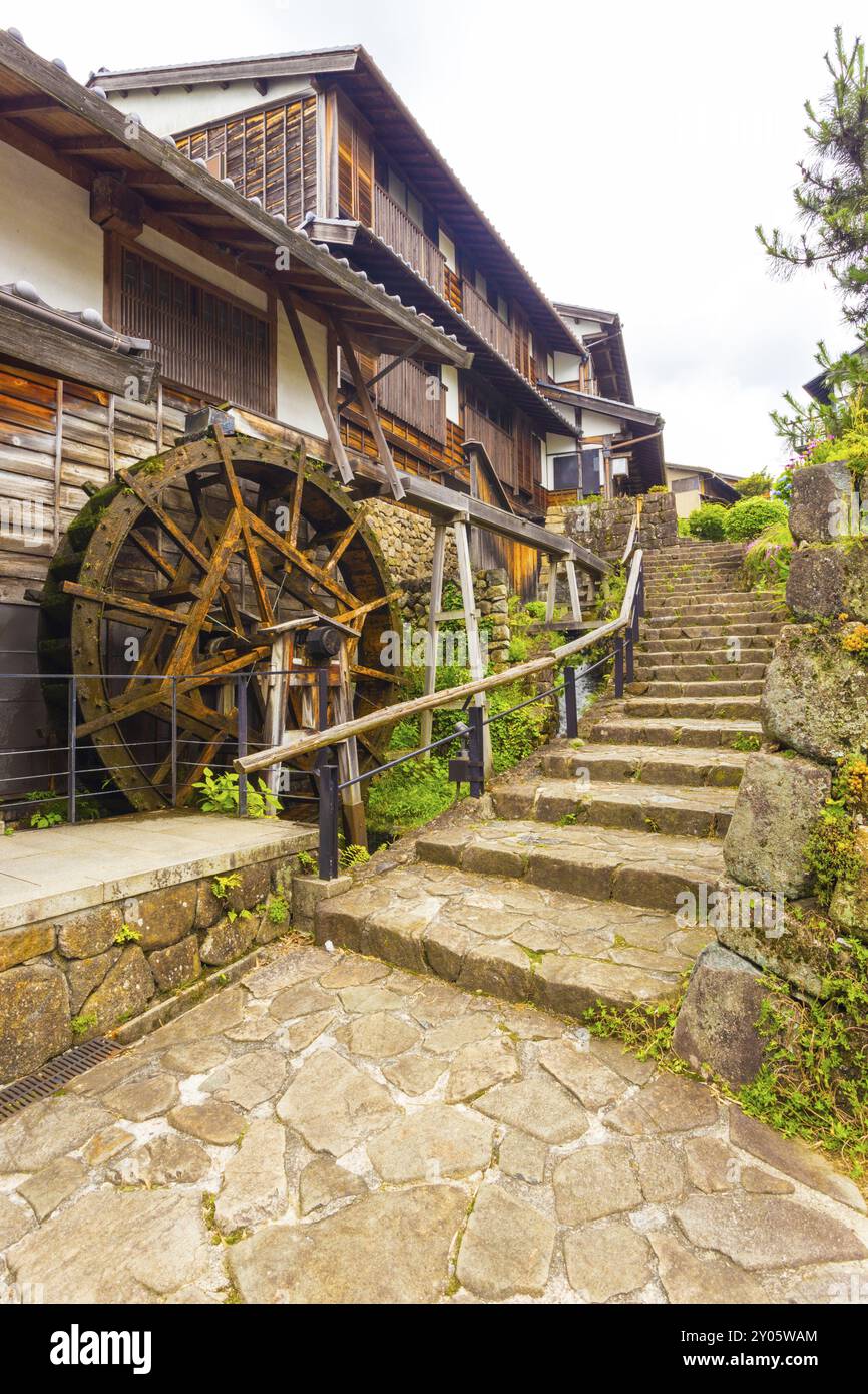 Stone steps next to traditional waterwheel in historic restored town of ...