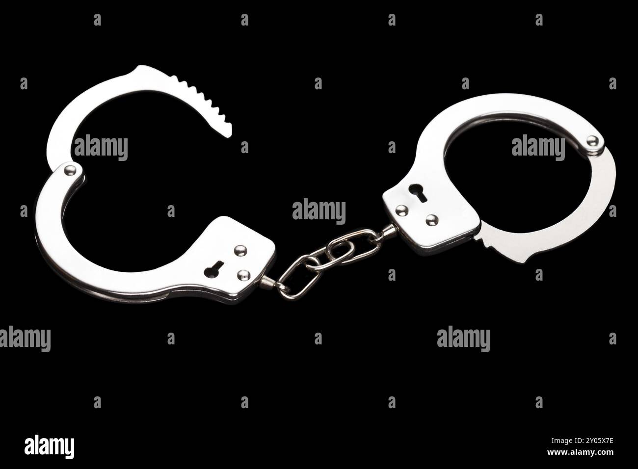 Crime law arrest police steel handcuffs isolated Stock Photo - Alamy