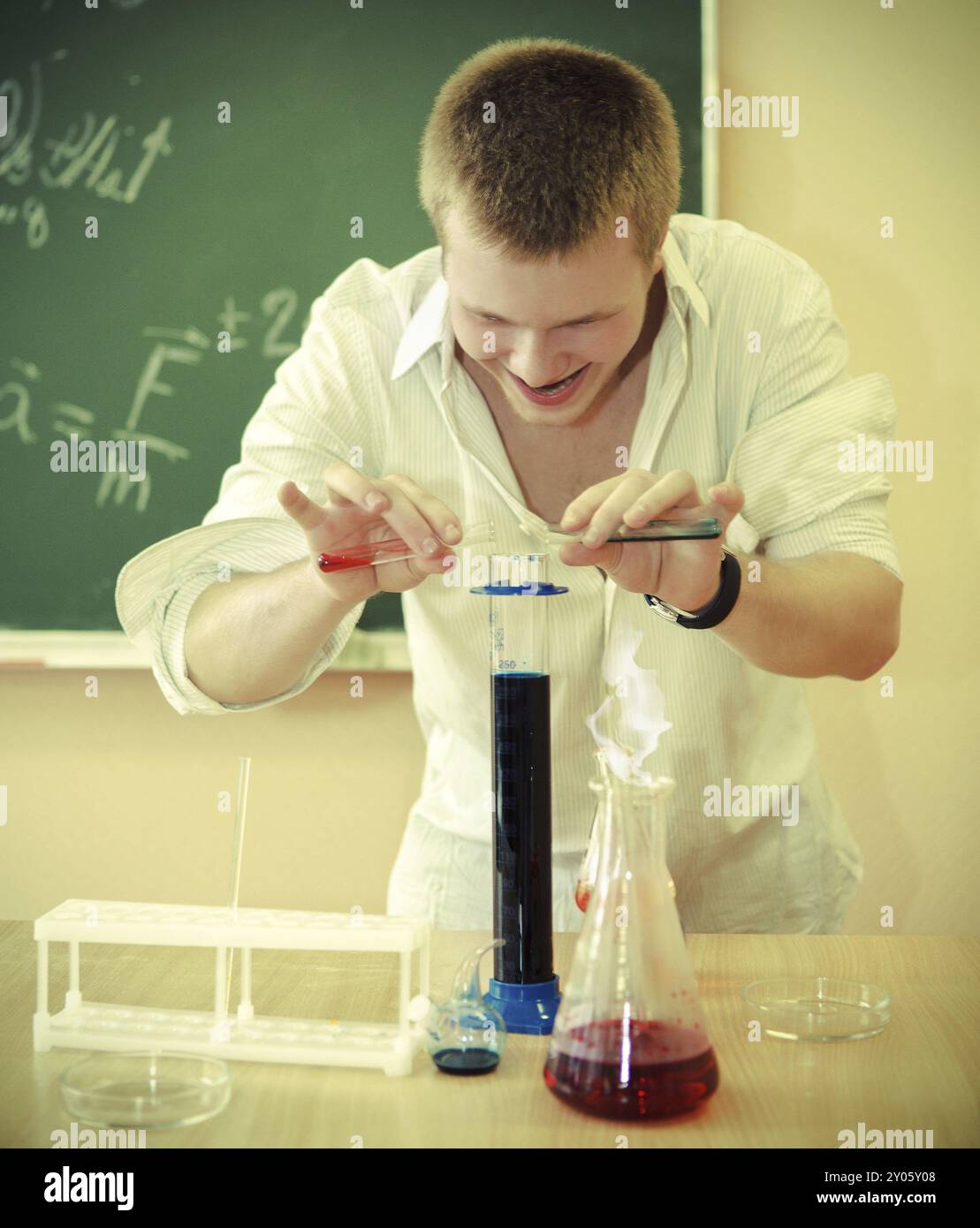 Crazy mad nerd scientist funny expression at laboratory on chemical ...