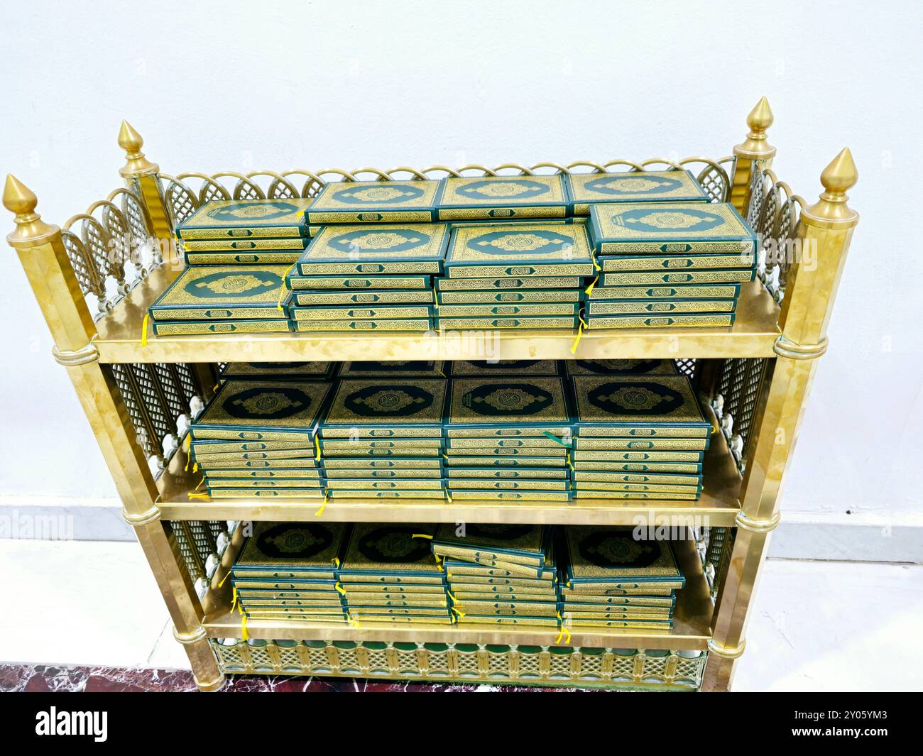 Translation of the Arabic text (Holy Quran), Stacks of holy Quran book ...