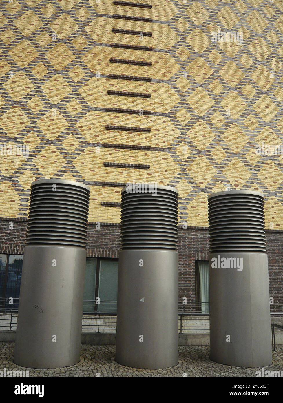 Three ventilation ducts in front of a decorative brick wall Stock Photo ...