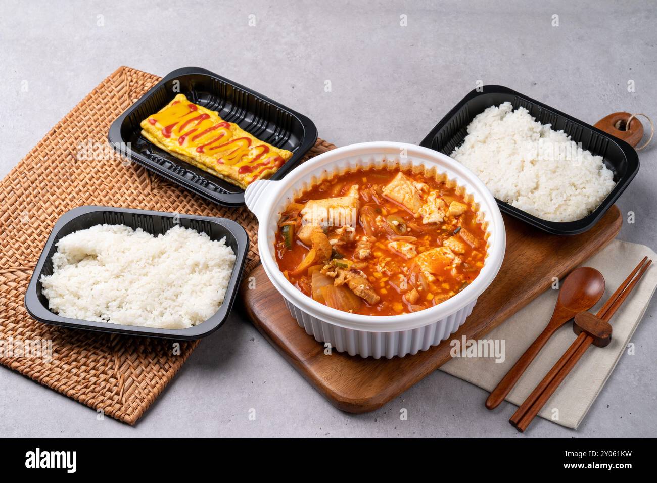 Korean food, kimchi stew, ham, soft tofu, pork, egg roll, rice, side ...