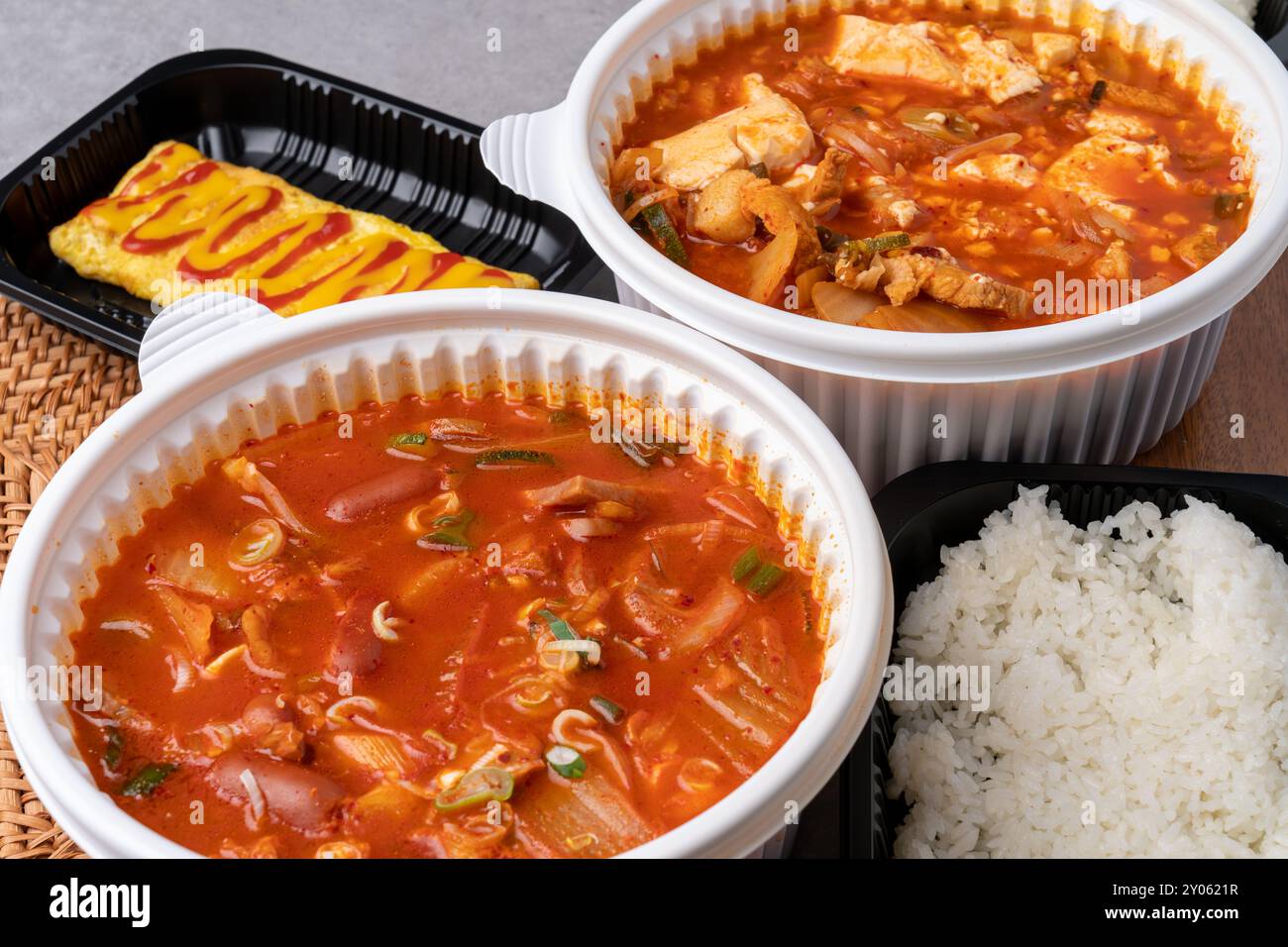 Korean food, kimchi stew, ham, soft tofu, pork, egg roll, rice, side ...