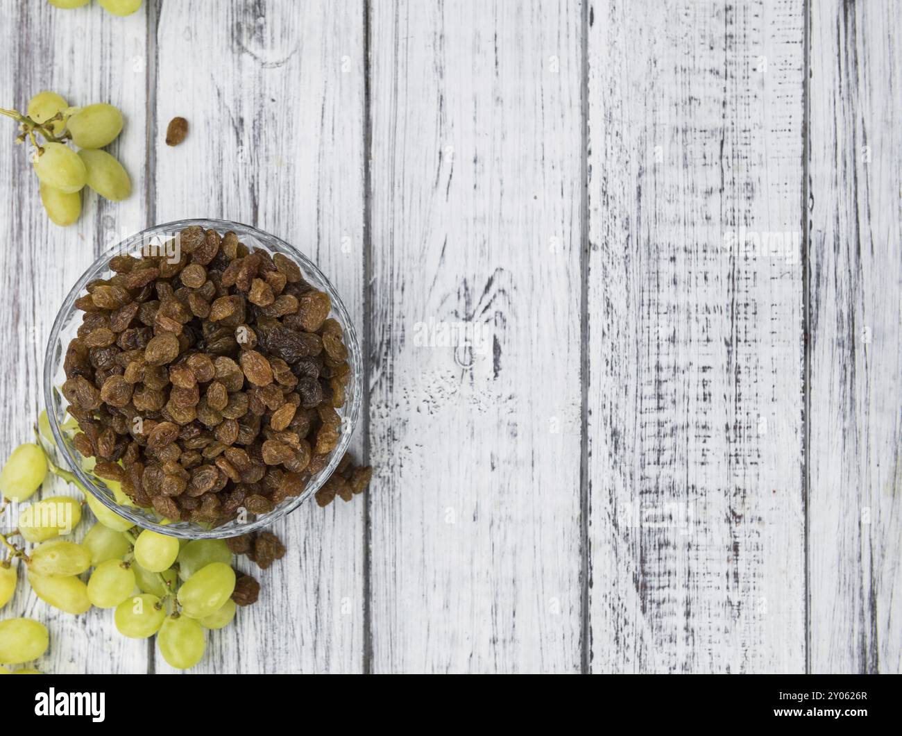 Wooden table with Raisins (detailed close-up shot, selective focus ...