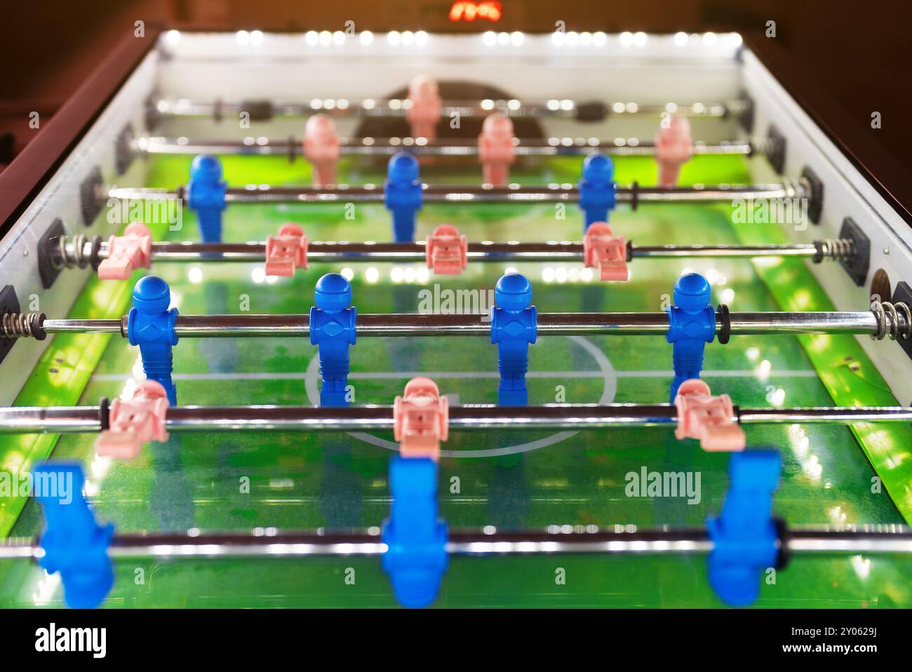 Table football game with white and blue players Stock Photo - Alamy