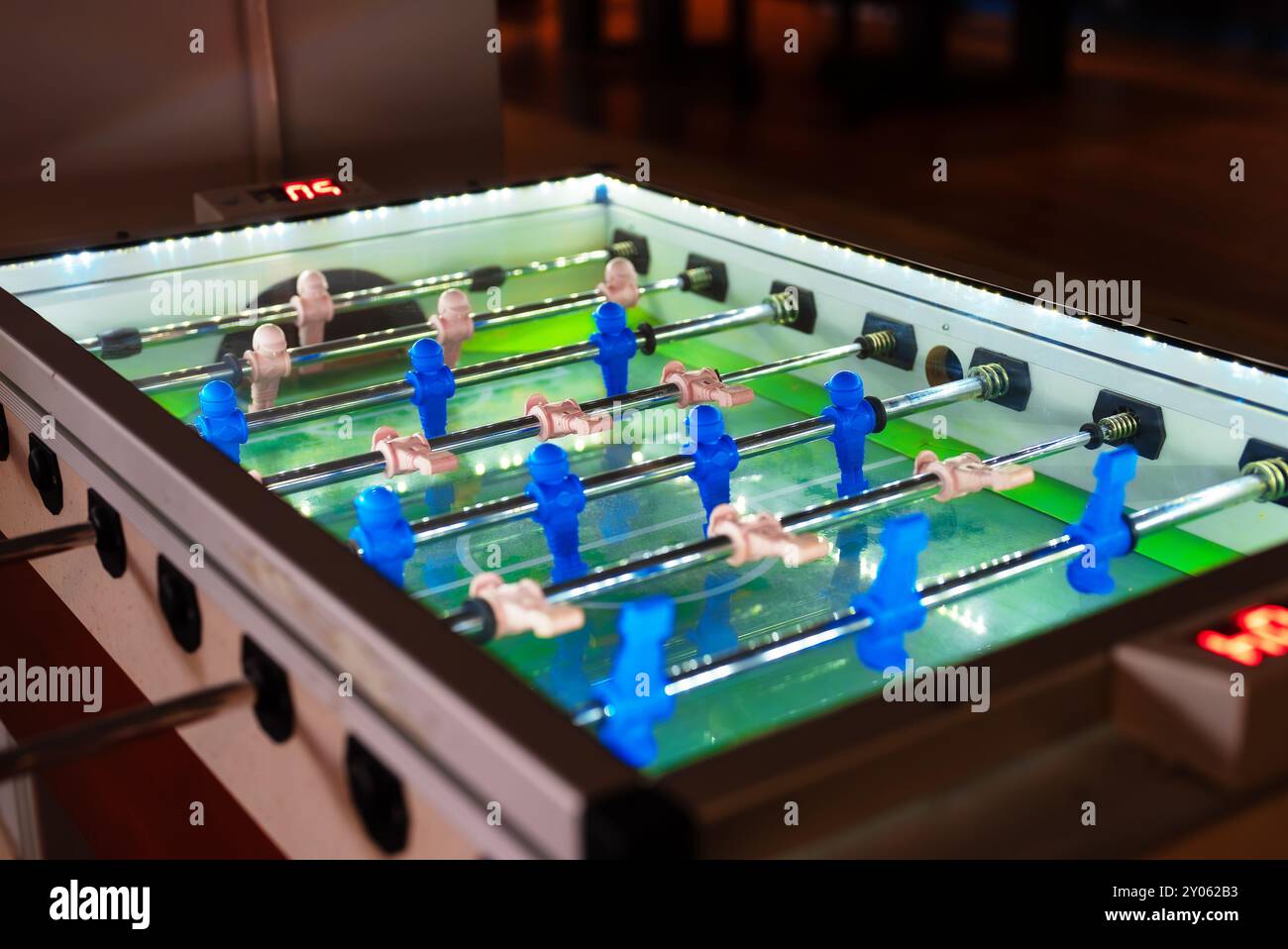 Table football game with white and blue players Stock Photo - Alamy