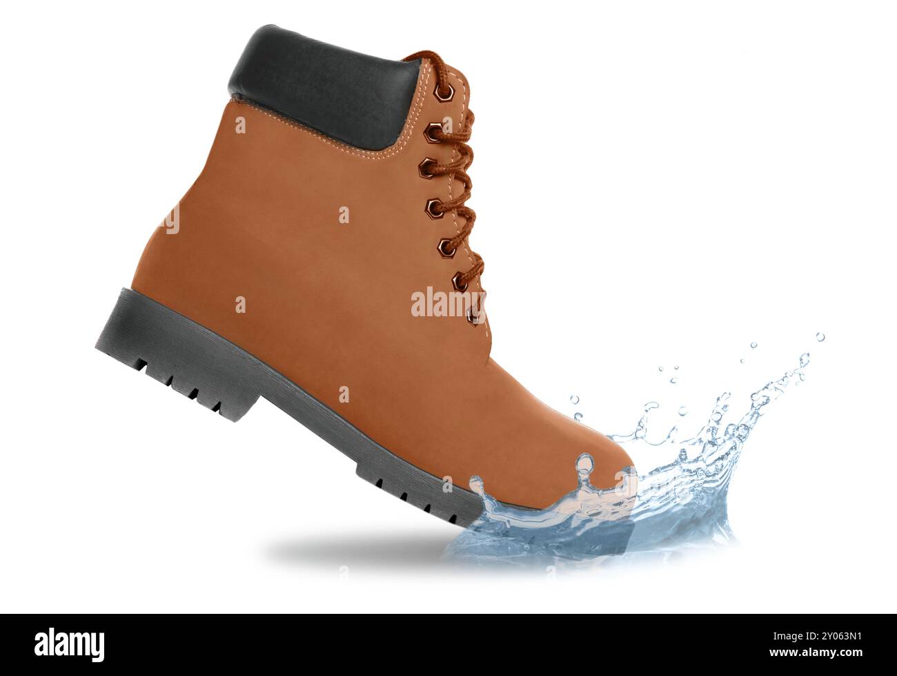 Brown boot and water splash. Side view. Isolated on white background ...