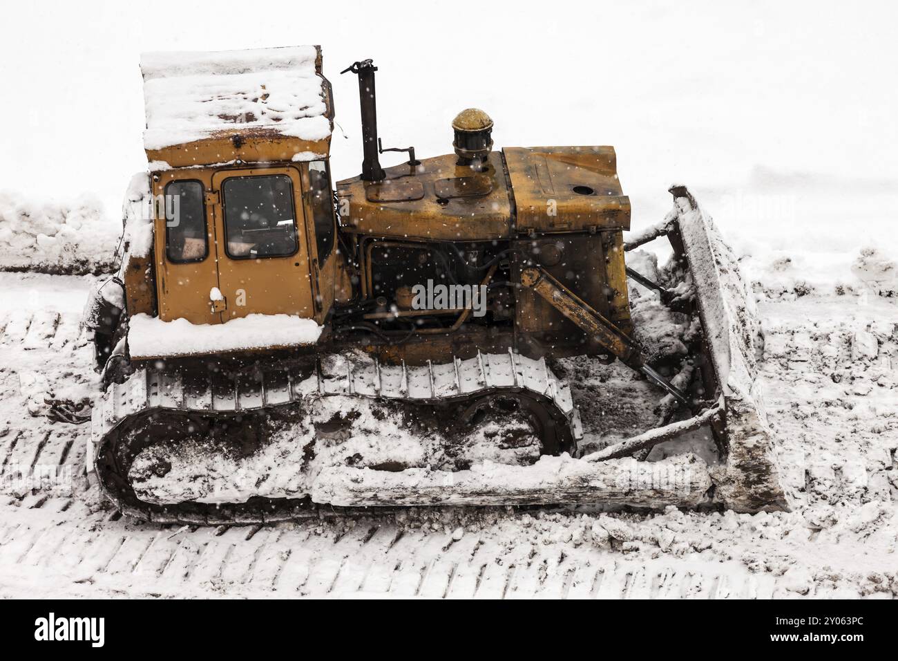 Old rusty earth digging caterpillar bulldozer machine working at ...