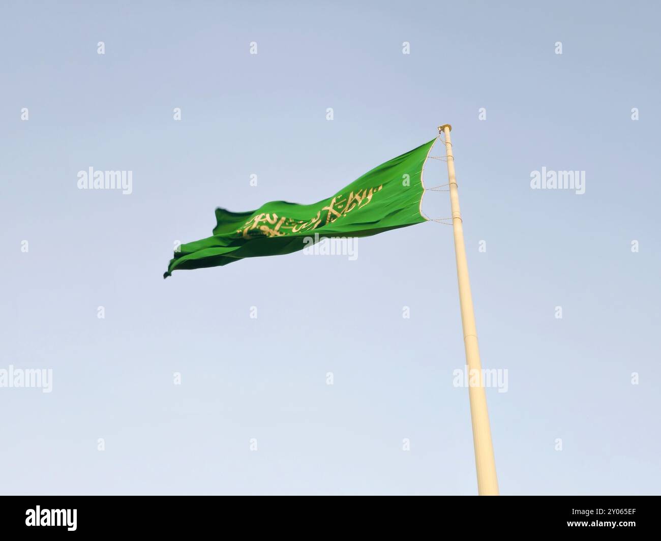 The national flag of Saudi Arabia kingdom, a green background with ...