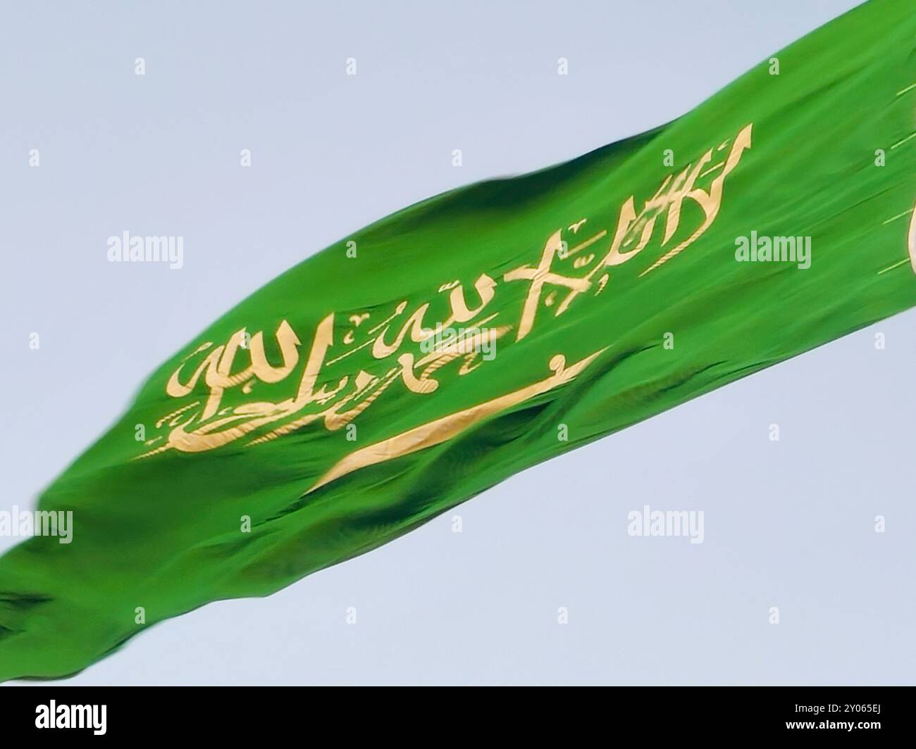 The national flag of Saudi Arabia kingdom, a green background with ...