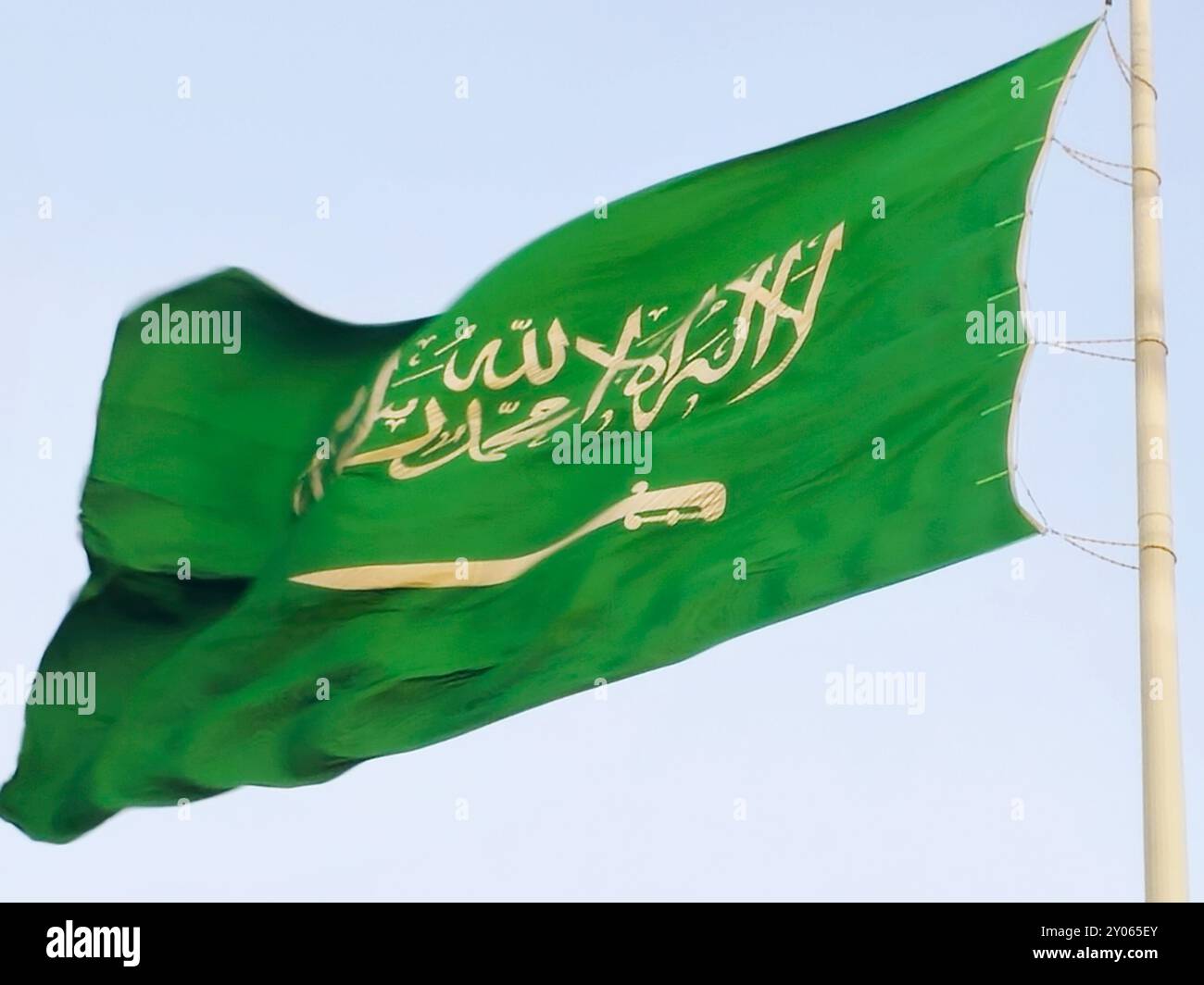 The national flag of Saudi Arabia kingdom, a green background with ...