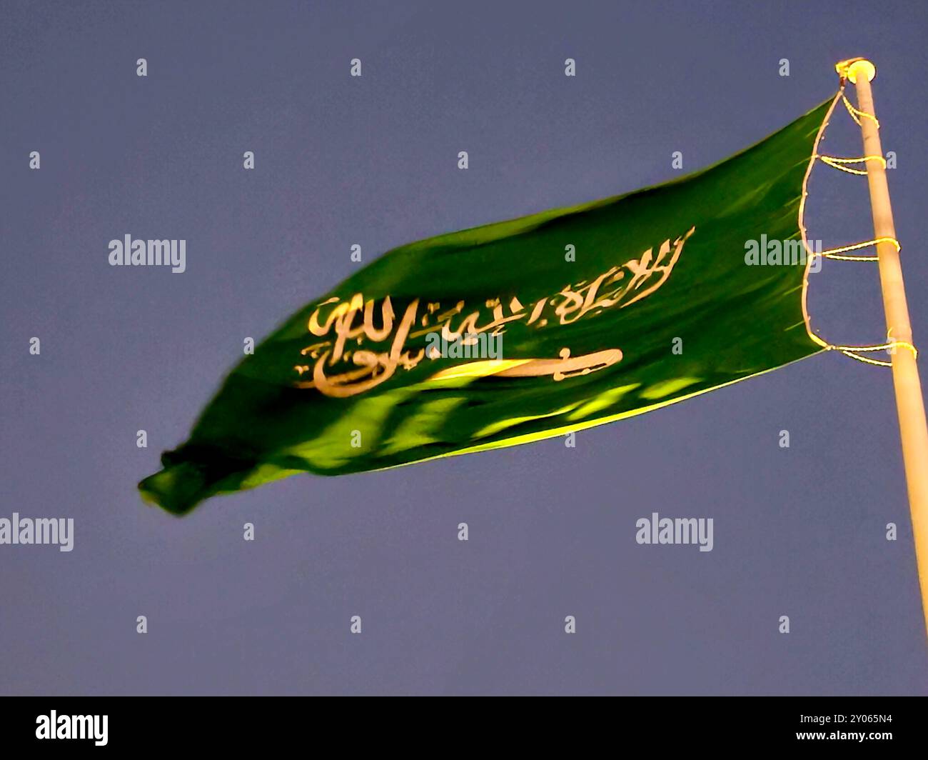 The national flag of Saudi Arabia kingdom, a green background with ...