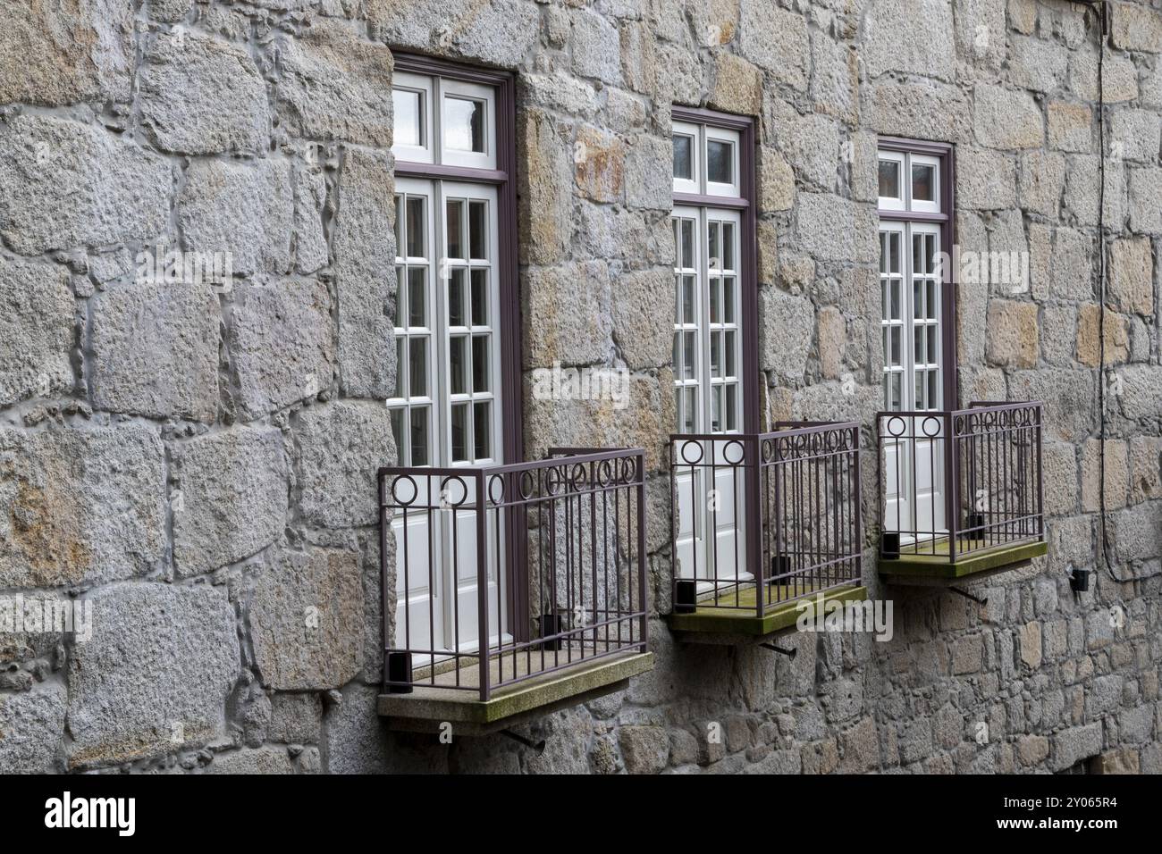 Windows and balconies on the historic facade of a house in the historic ...
