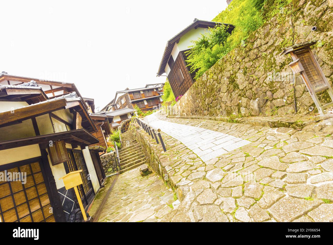 Stone path southern entrance to historic Magome station post town along ...