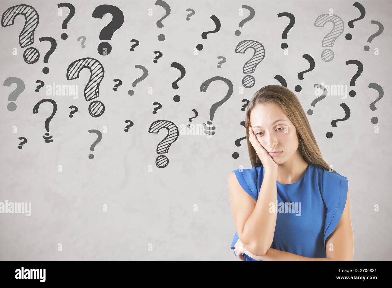Bored and sad woman with lots of doubts and question marks around her ...