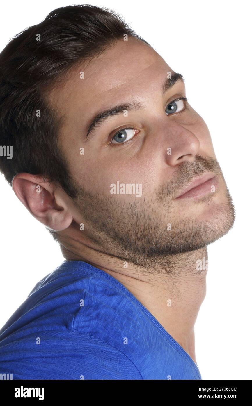 Portrait of a 20 years old caucasian young man with blue eyes looking ...