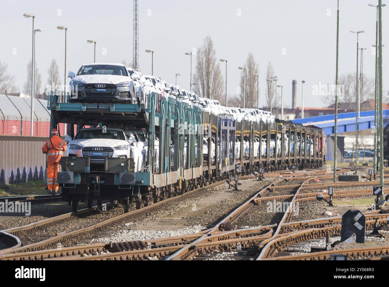 New cars are transported by train. Cars carried by train Stock Photo ...
