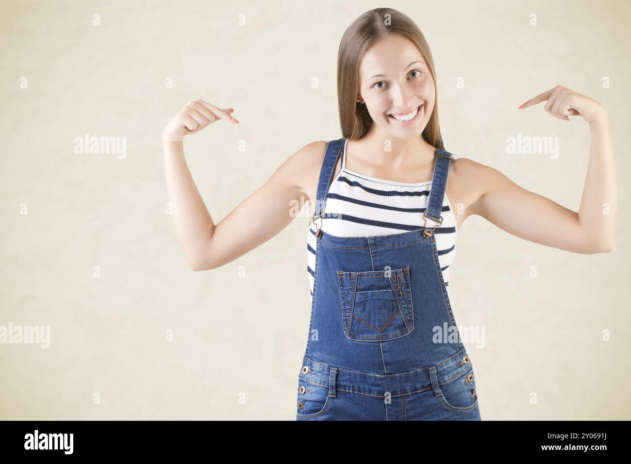 Woman smiling confidently points herself hi-res stock photography and ...
