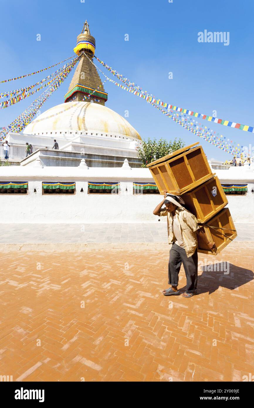 Kathmandu, Nepal, October 18, 2013: Nepali porter carrying large, heavy ...