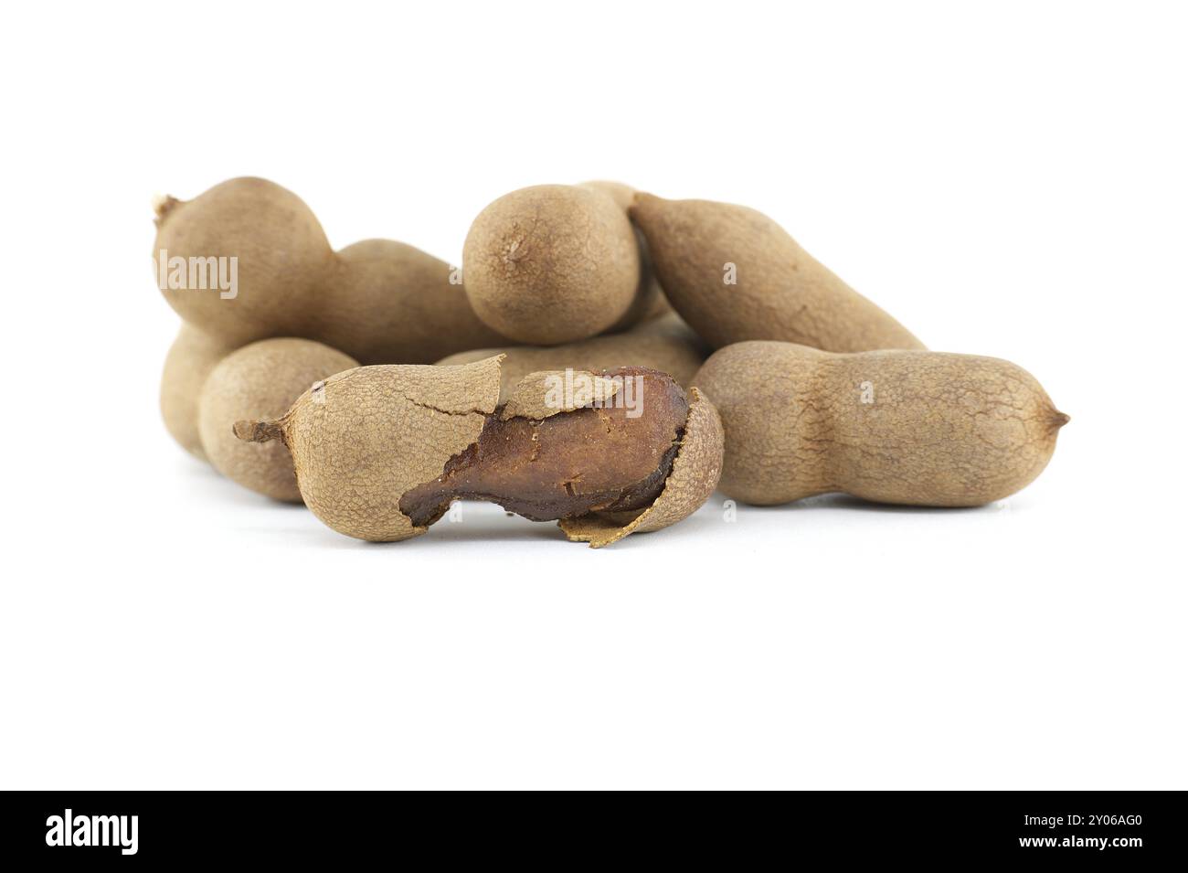 Tamarind fruits, whole and cracked open isolated on white background ...