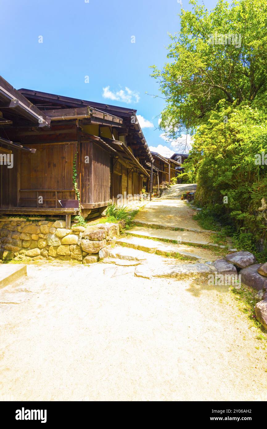 A lovely set of rustic wooden houses and dirt road restored to an ...