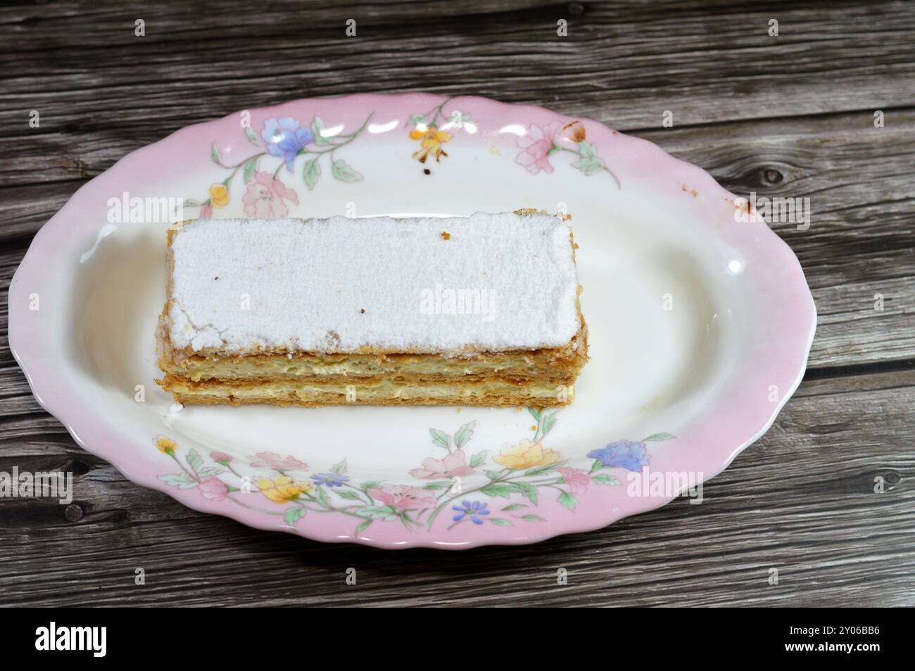 Classic powdered sugar Mille feuille cake gateau made of milk, egg ...