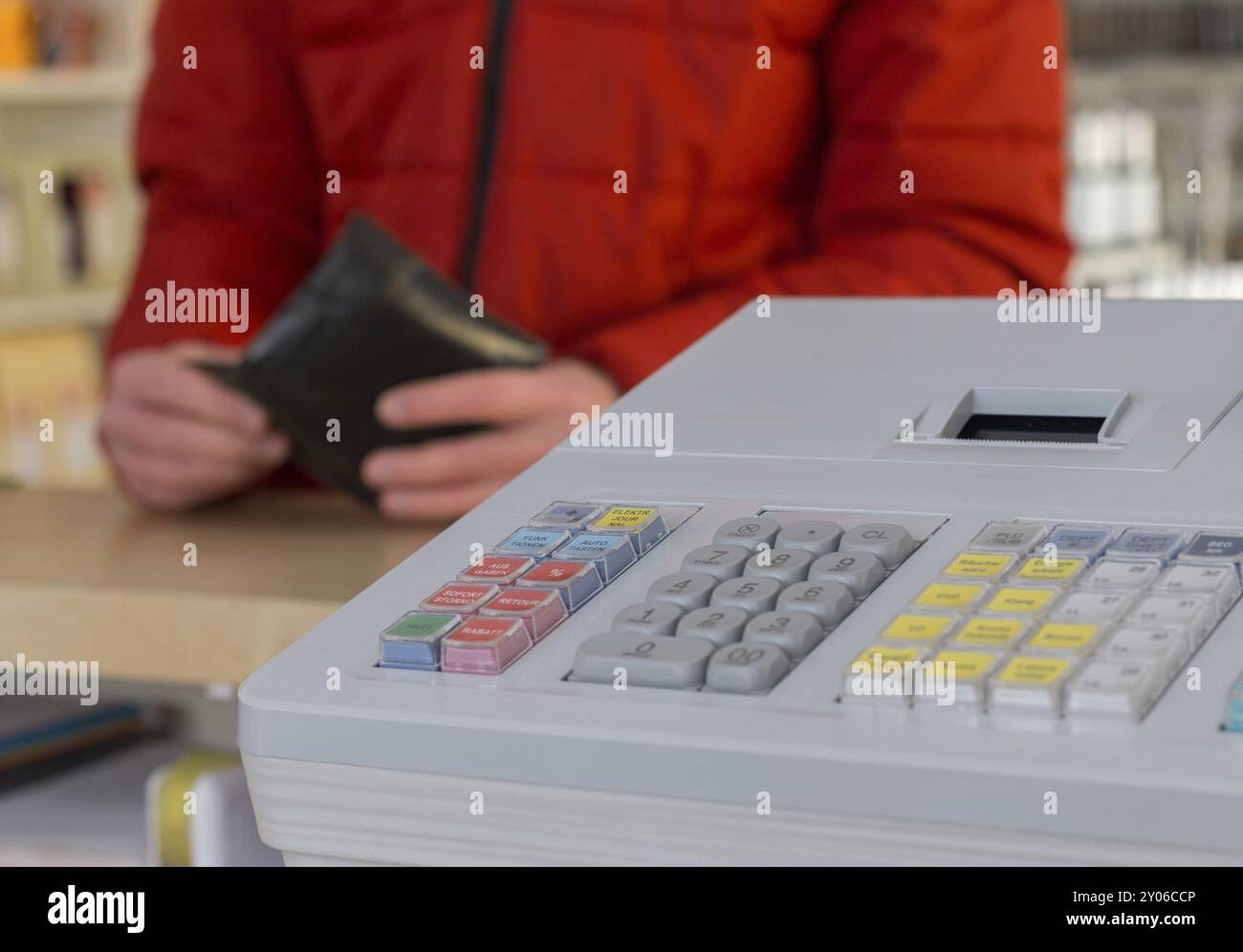 Cash register in a shop: Customer is paying purchase Stock Photo - Alamy