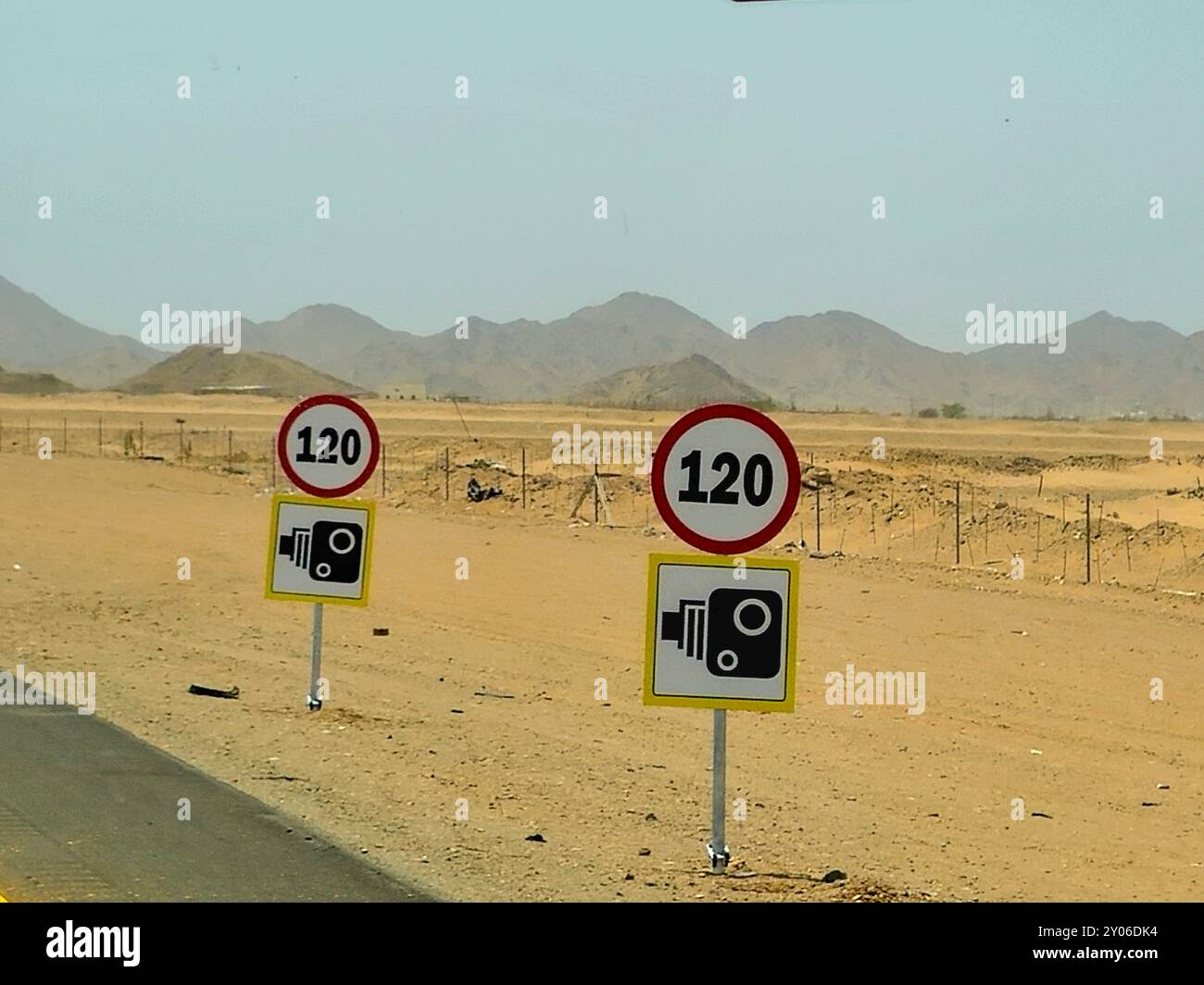 120 KM maximum speed limit sign with a speed camera road sign at Mecca ...