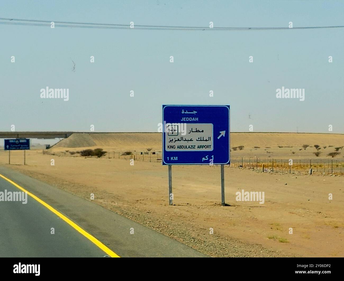 Makkah Madinah road, Saudi Arabia, June 25 2024: Jeddah and King AbdulAziz airport road sign ...