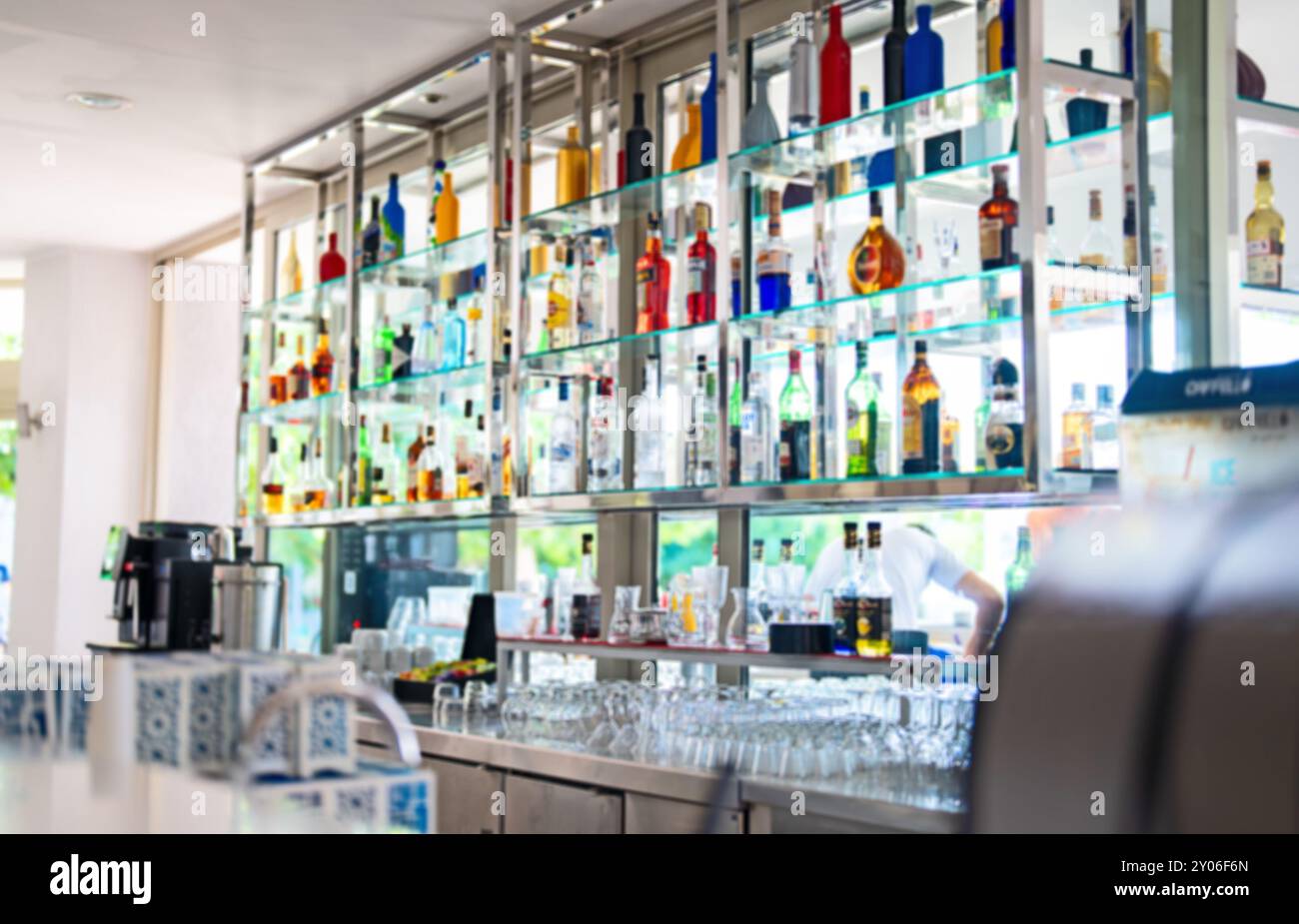 Lots of alcohol bottles in a bar. Blurred image Stock Photo - Alamy