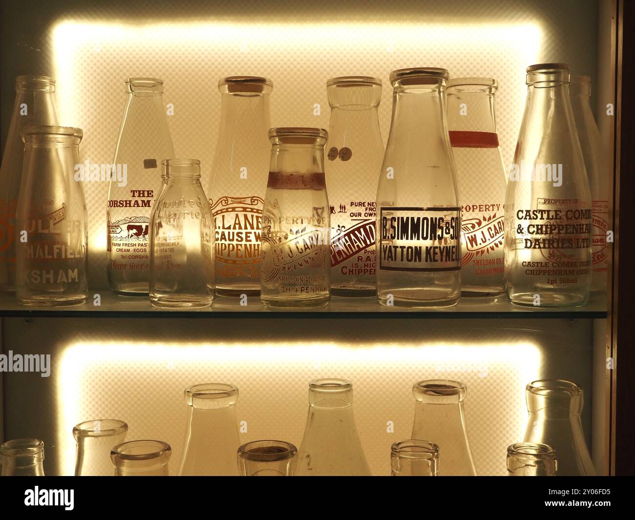 Selection of vintage glass milk bottles bearing name or names of dairy ...