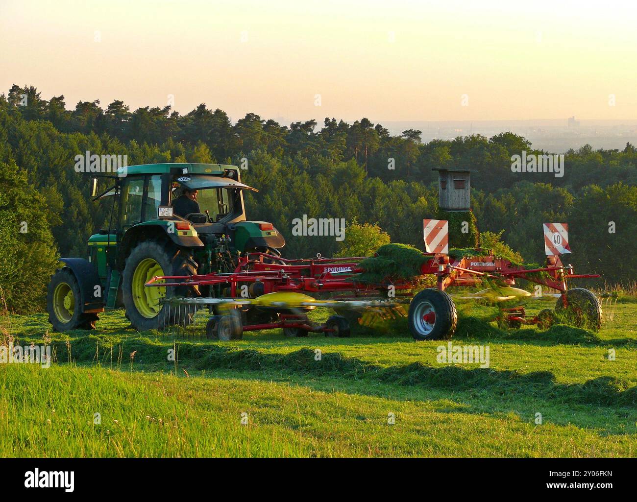 Farmer rakes hay in hi-res stock photography and images - Alamy