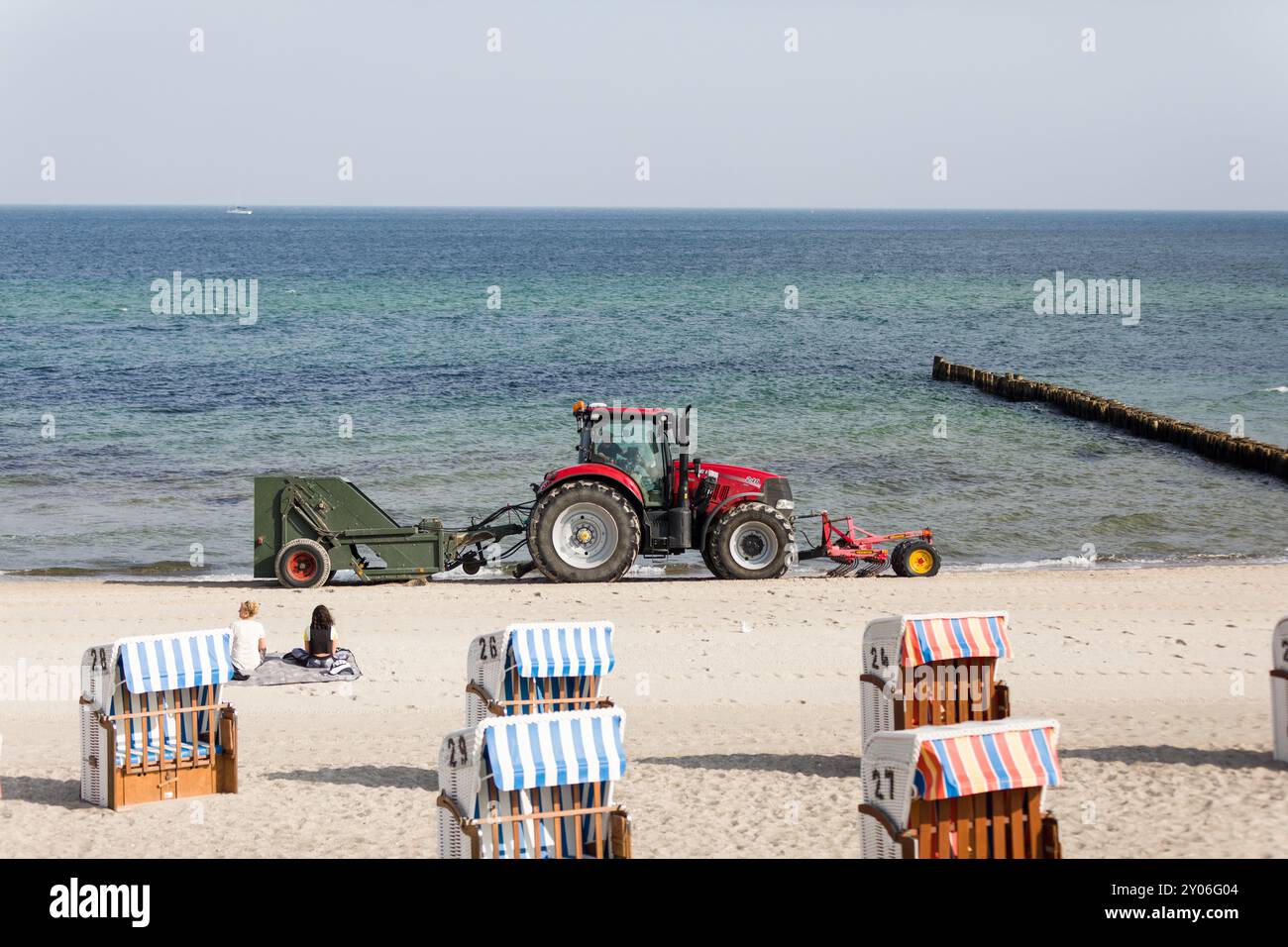 Beach maintenance with a tractor Stock Photo - Alamy
