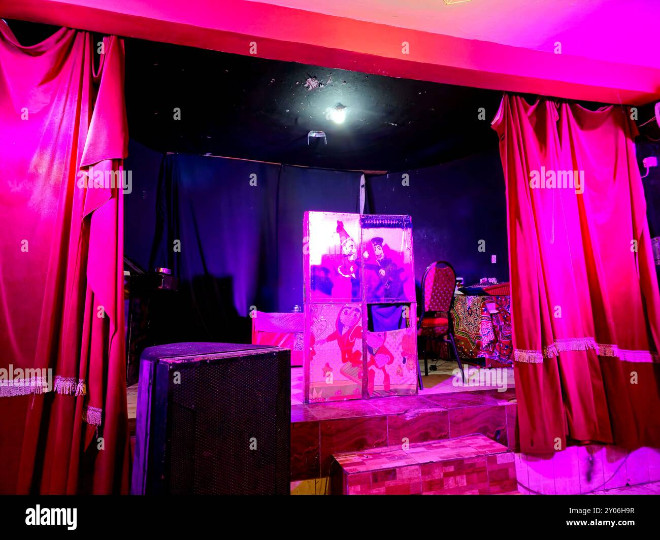 Cairo, Egypt, July 27 2024: Egyptian Aragouz or puppet, with a small portable stage set up, and ...