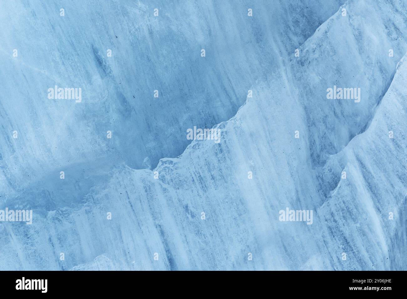 Close-up wall of a centuries-old glacier with a structure of stripes ...