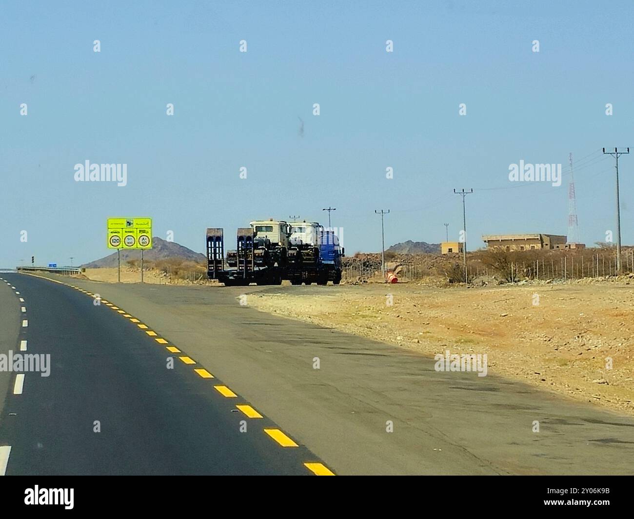 Makkah Madinah road, Saudi Arabia, June 25 2024: A big flatbed truck ...