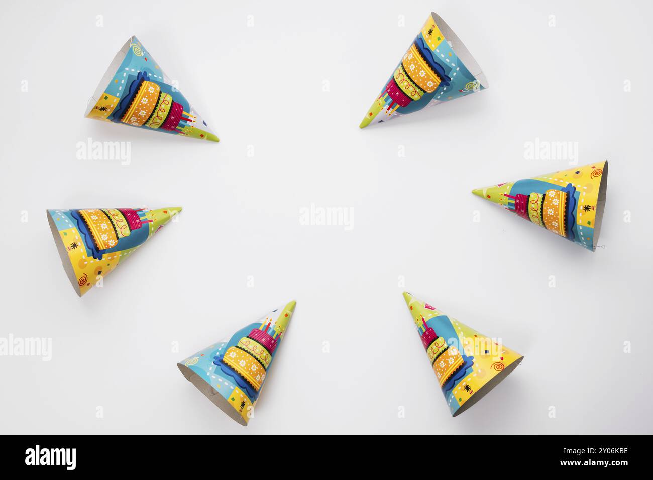 Overhead view party hats arranged white background Stock Photo - Alamy
