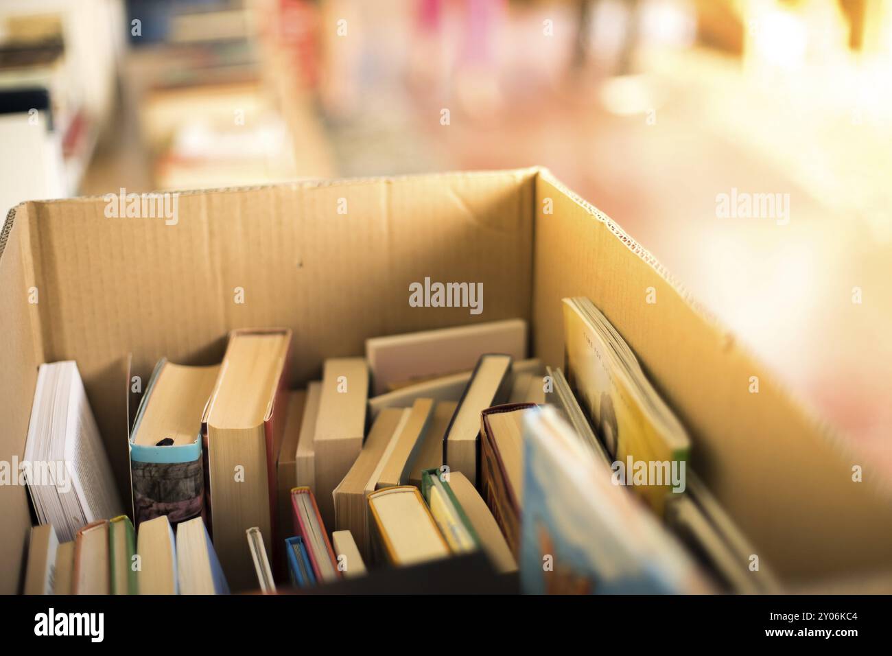 Stack of books, blurry background: Charity book flea market, outdoors ...