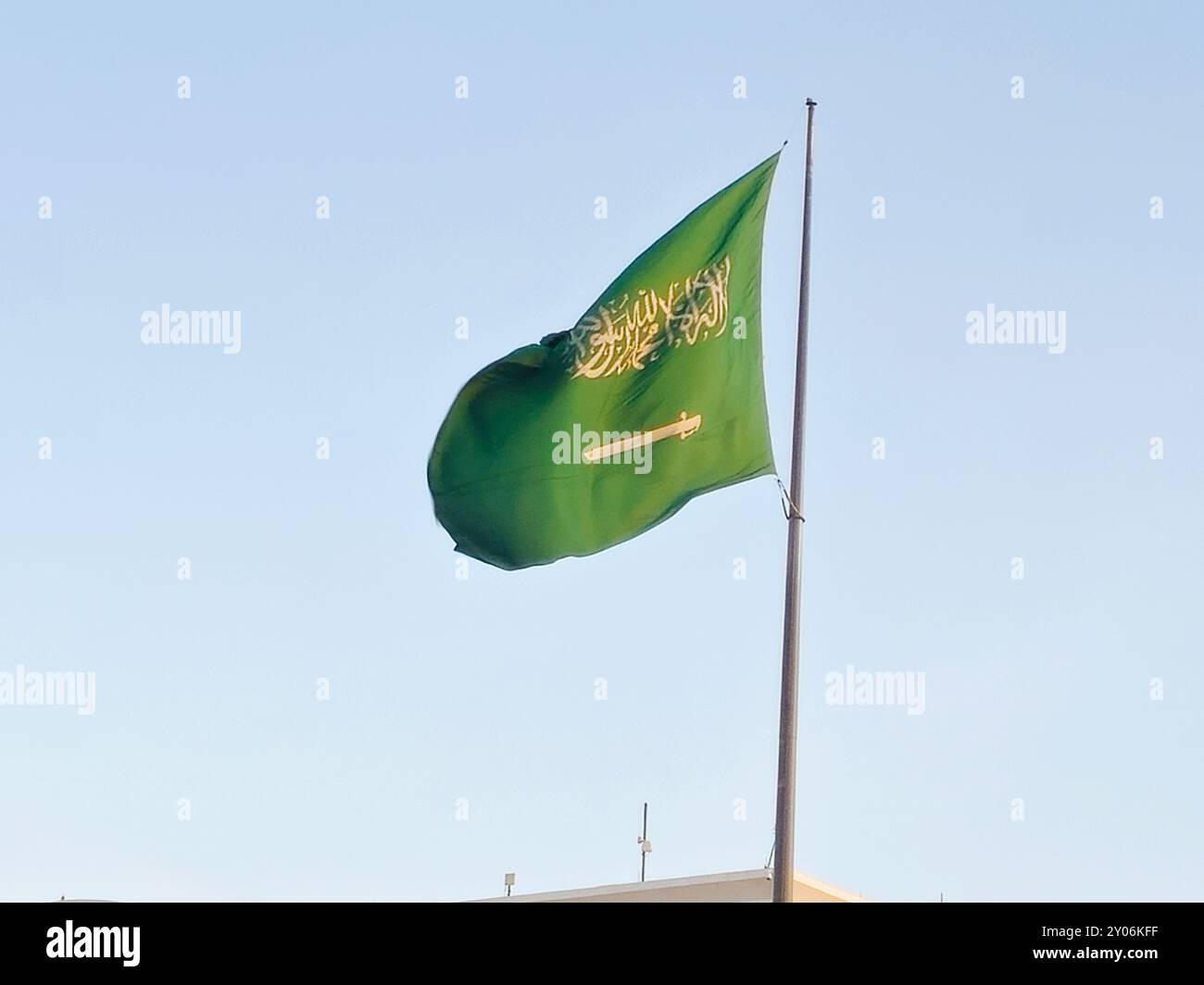 The national flag of Saudi Arabia kingdom, a green background with ...