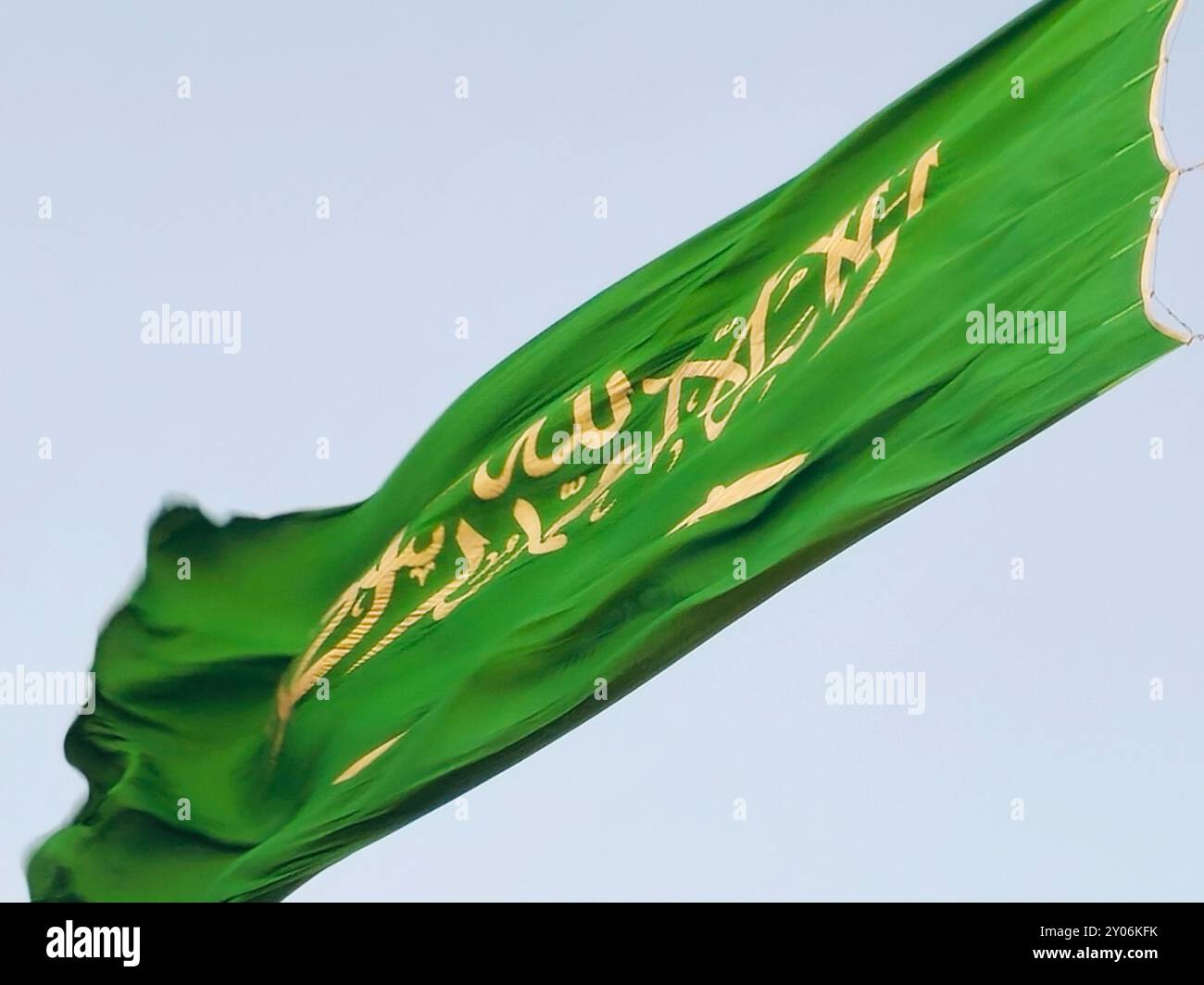The national flag of Saudi Arabia kingdom, a green background with ...