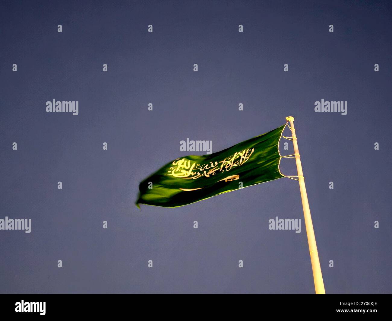 The national flag of Saudi Arabia kingdom, a green background with ...