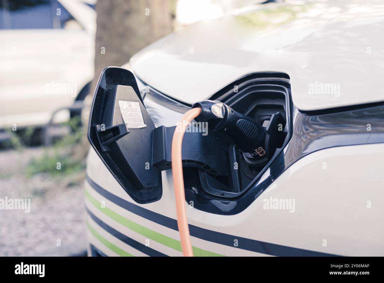 Electric car recharging with charge cable and plug leading to charge ...